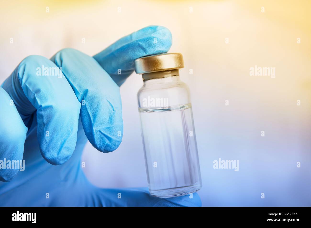 Doctor holding vial with medication, closeup. Vaccination and ...
