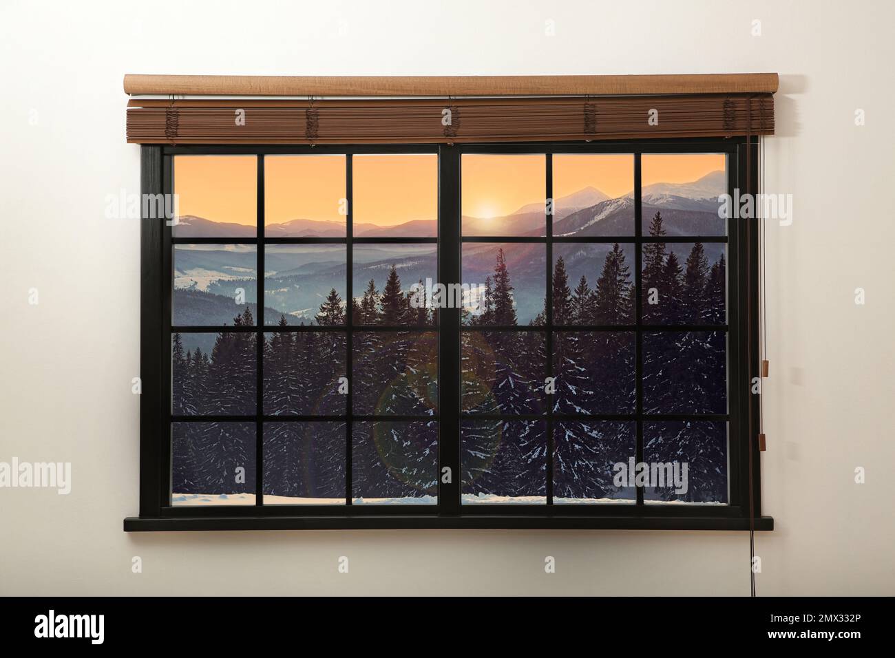 Beautiful view of snowy forest at sunset through big window Stock Photo ...