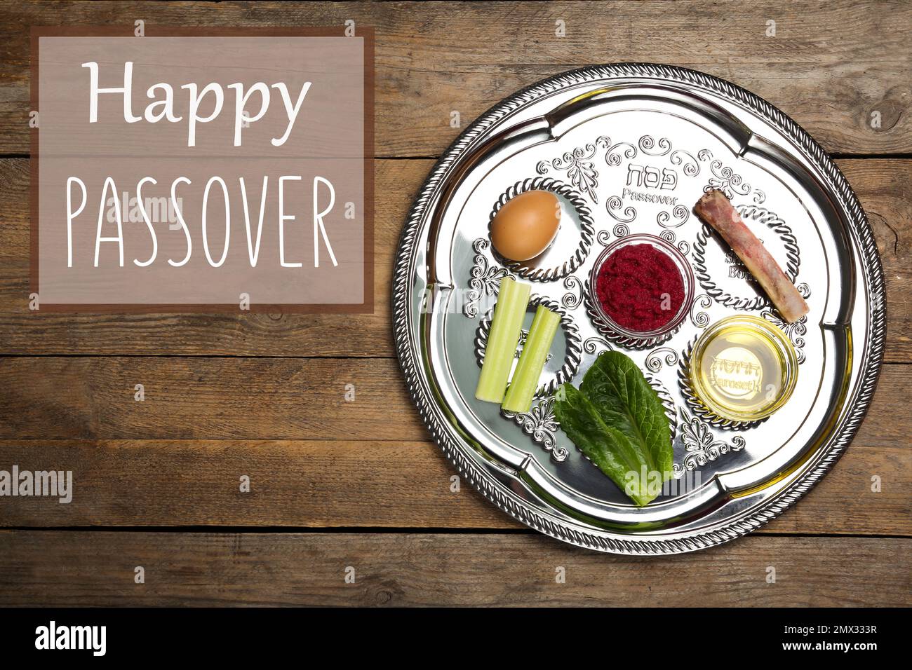 Passover Seder plate (keara) on wooden table, top view. Pesah ...