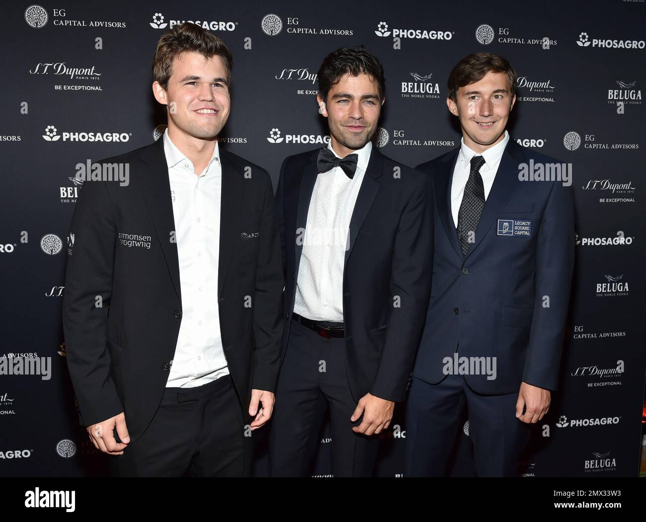 Chess champion Magnus Carlsen, left, actor Adrian Grenier and chess ...