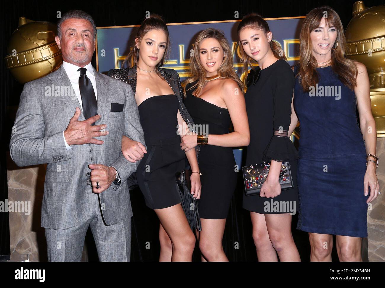 Sylvester Stallone, left, and Jennifer Flavin, right, pose with their ...