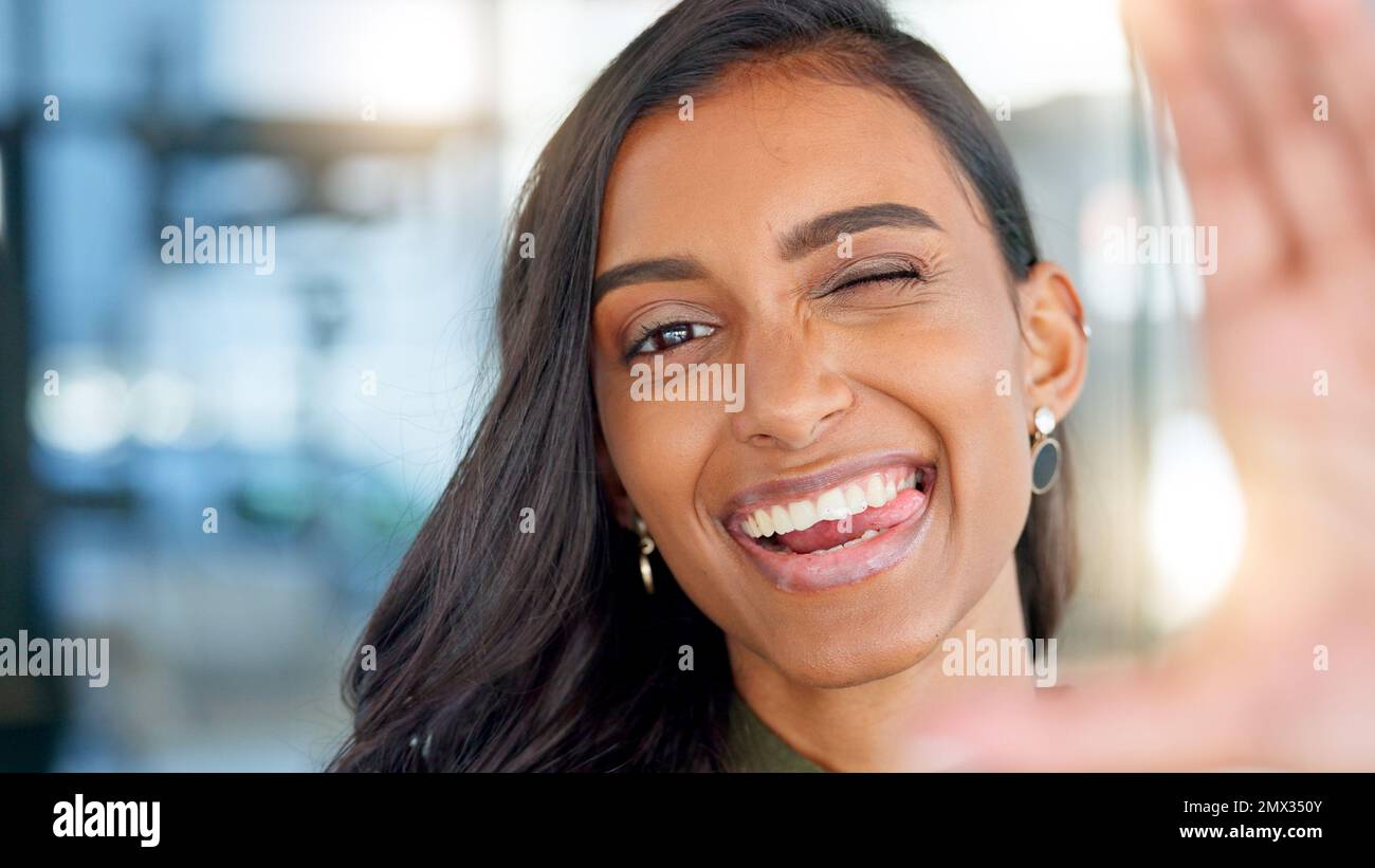 Face of a happy business woman smiling, making funny expressions and ...