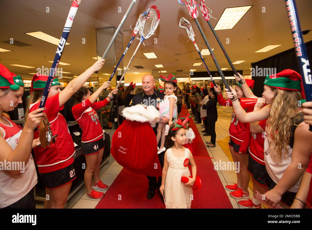 IMAGE DISTRIBUTED FOR MACY'S - Wish kid Emily G. is held by Fresno ...