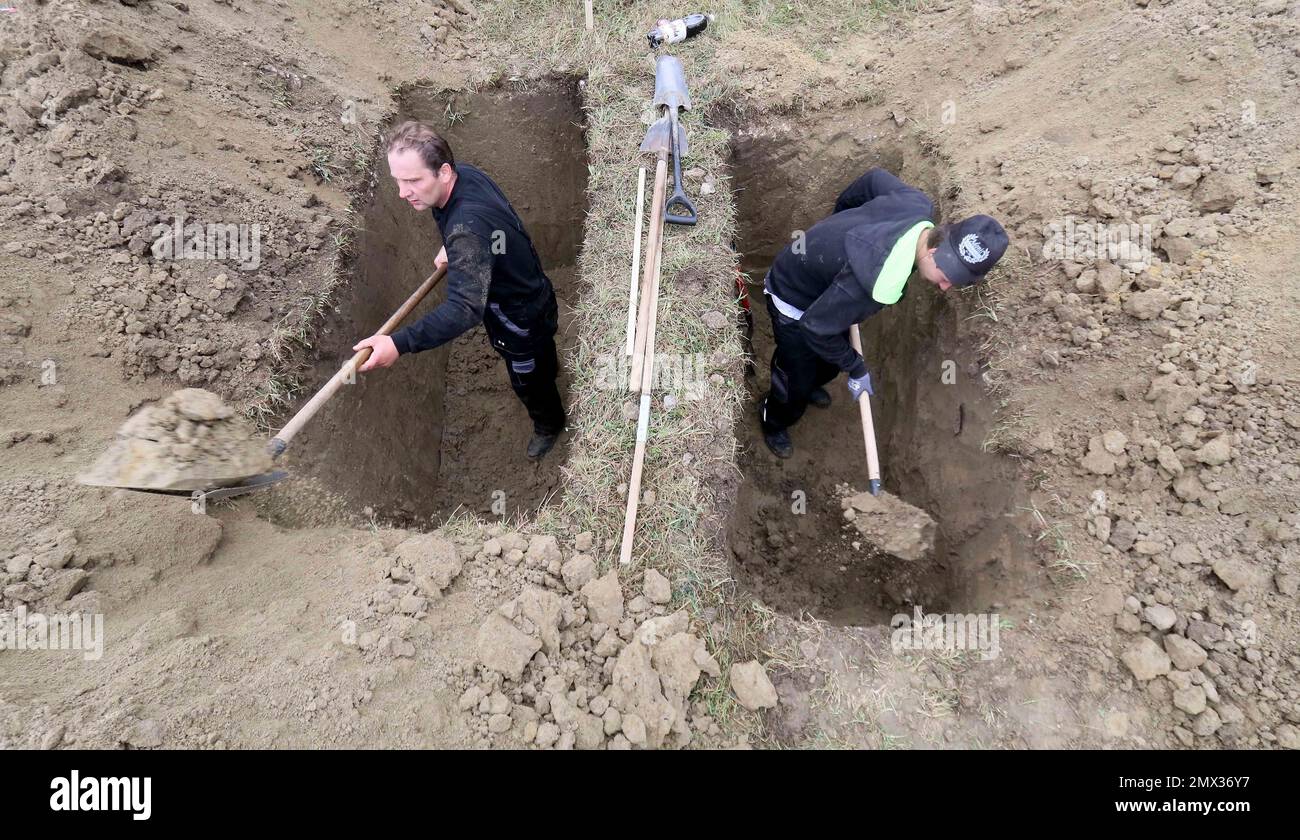 Grave diggers compete during the Grave Digging Championships in Trencin ...