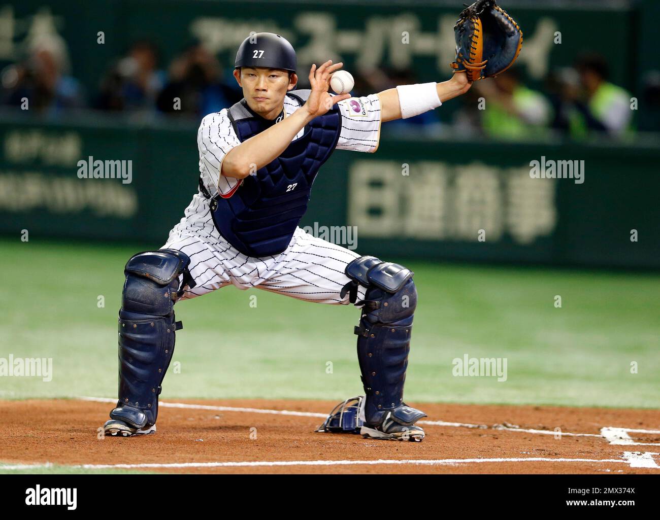 Japan's catcher Shota Ono looks at third-base runner after getting Mexico's Jesus Castillo ...