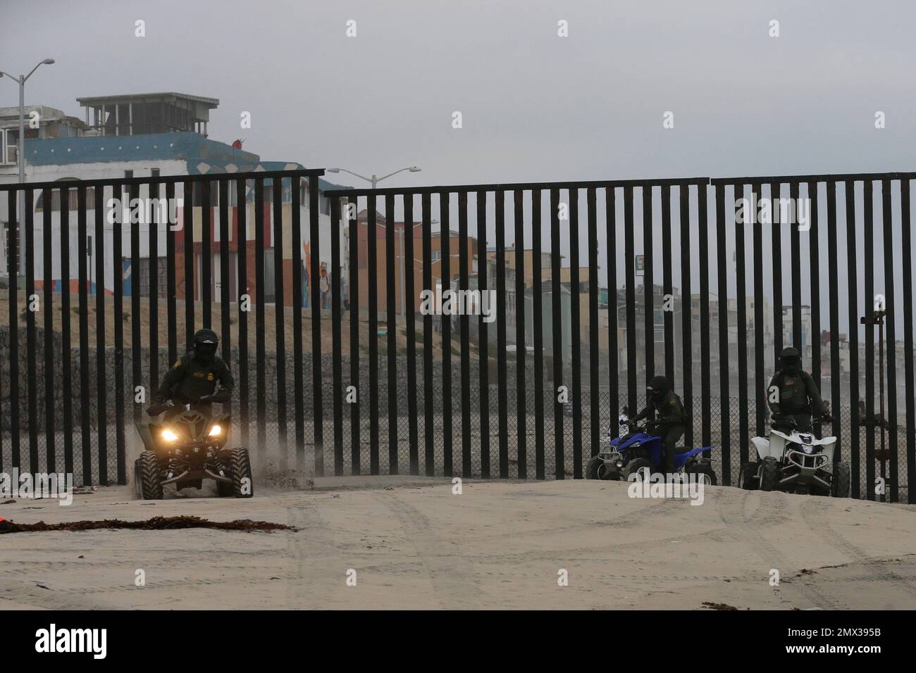 In this June 22, 2016 picture, Border Patrol agents ride all-terrain ...