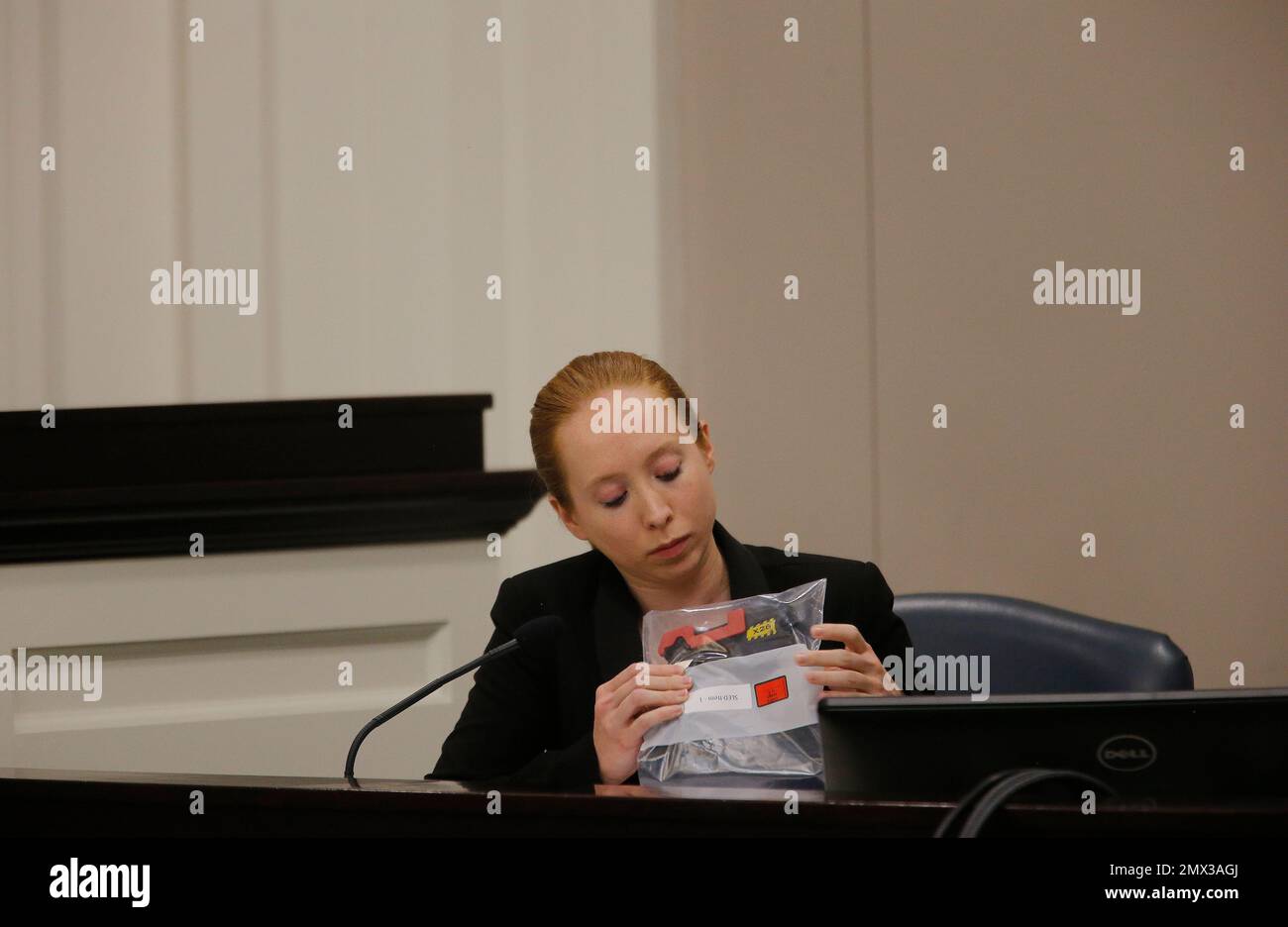 Witness, crime scene investigator, Jamie Johnson looks over former ...