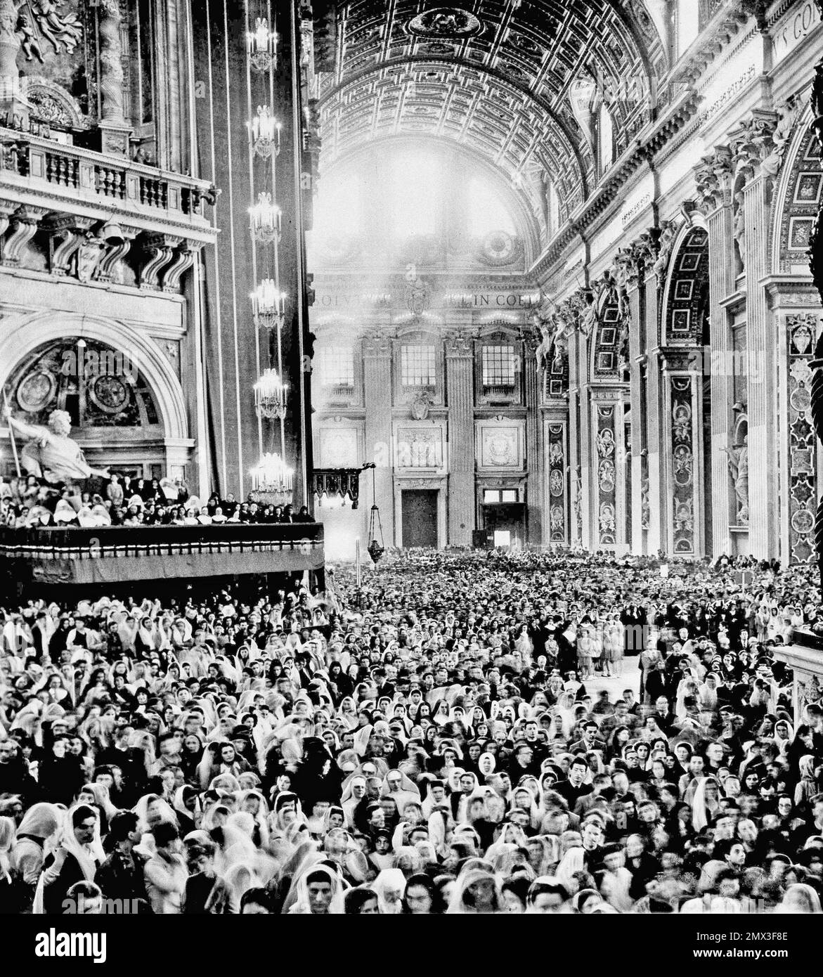 Part of the crowd of 40,000 people stand as they attend the ...