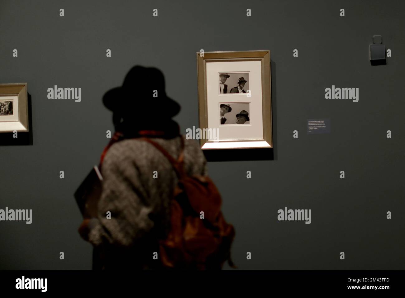 A woman walks past Czech photographer Jaromir Funke's untitled prints ...