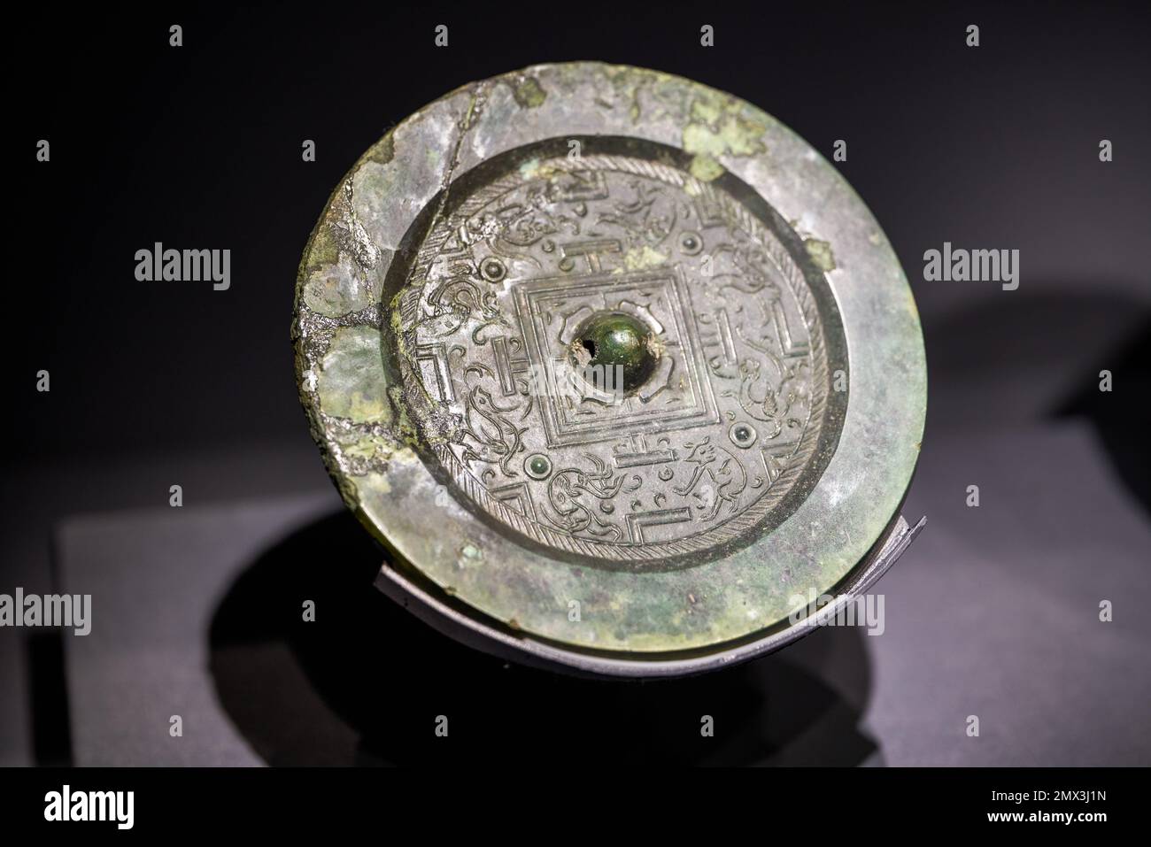 A close-up of a bronze mirror relic used in ancient China Stock Photo ...