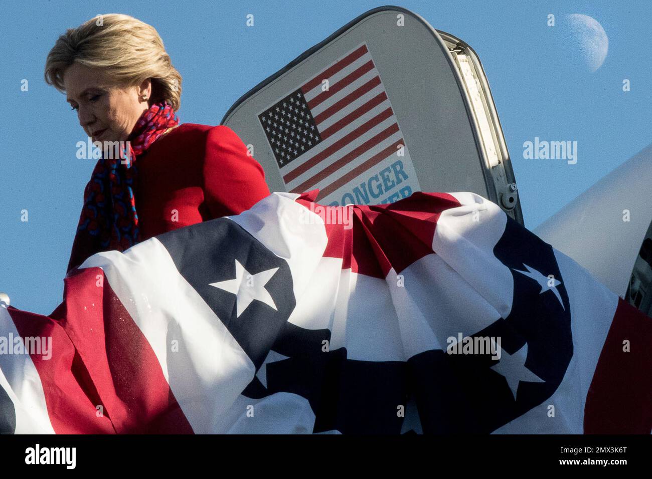The moon is visible, right, as Democratic presidential candidate ...