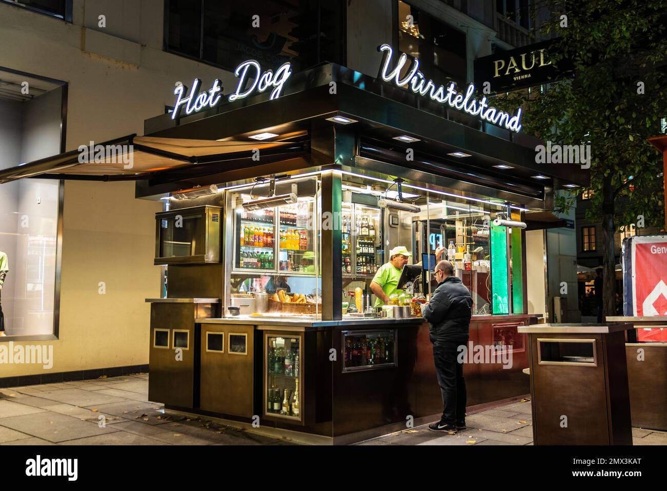 Vienna, Austria - October 16, 2022: Vendor in its sausage kiosk or ...