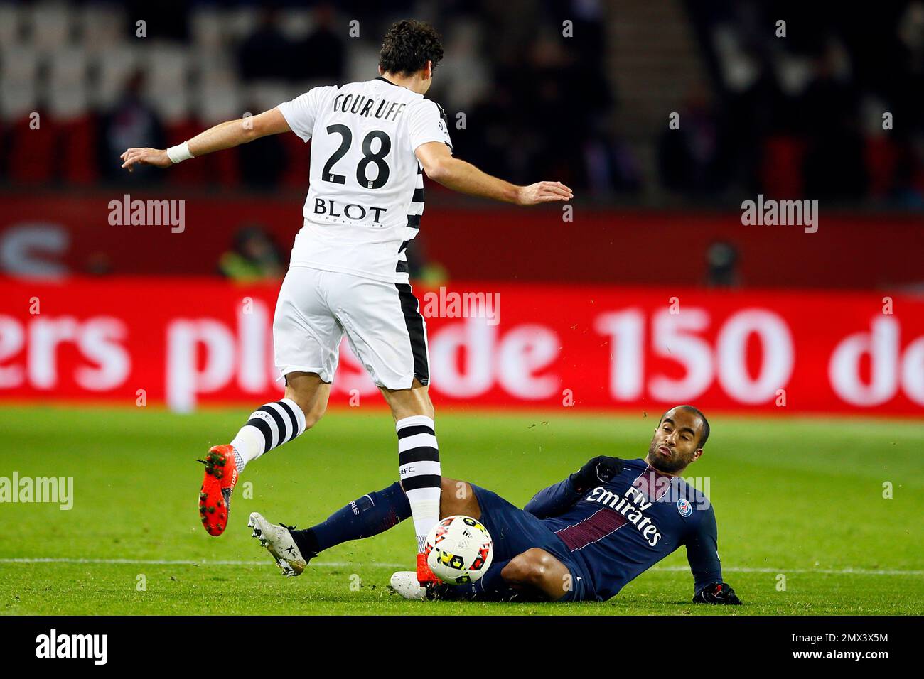 PSG's Lucas, right, challenges for the ball with Rennes' Yohann ...