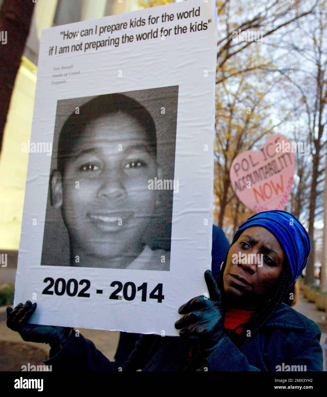 FILE - In this Dec. 1, 2014 file photo, Tomiko Shine holds up a picture ...