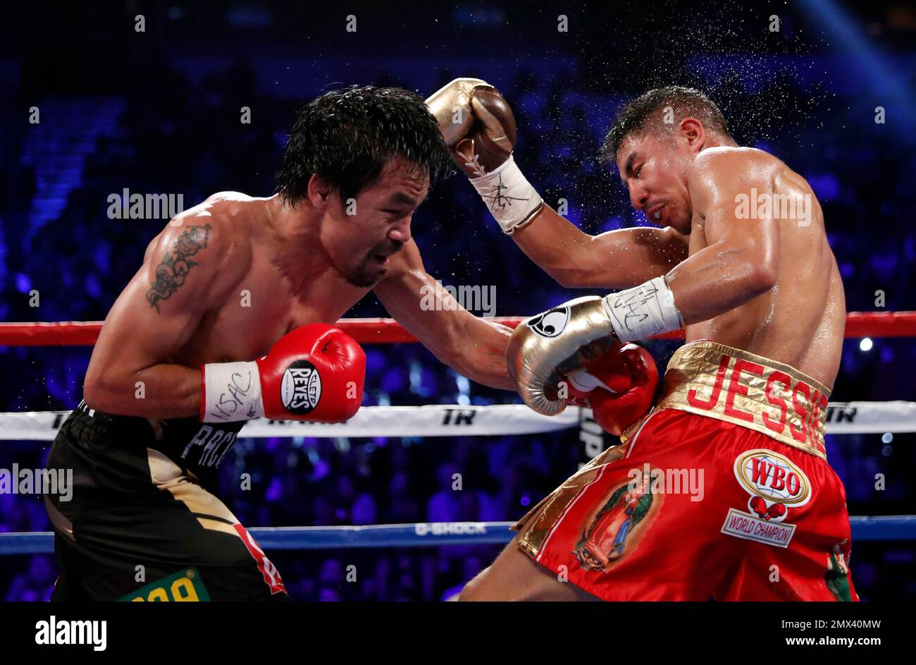 Jessie Vargas and Manny Pacquiao, of the Philippines, trade blows ...