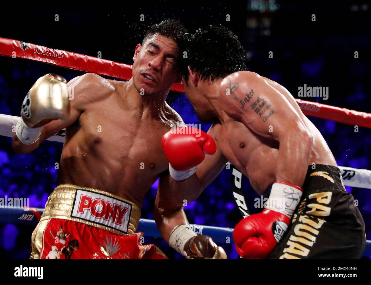 Jessie Vargas and Manny Pacquiao, of the Philippines, trade blows ...
