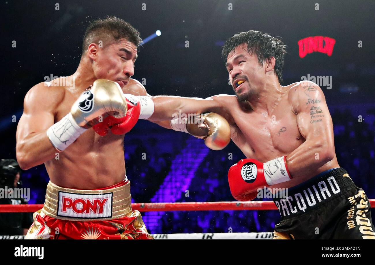 Manny Pacquiao, right, of the Philippines, hits Jessie Vargas during ...
