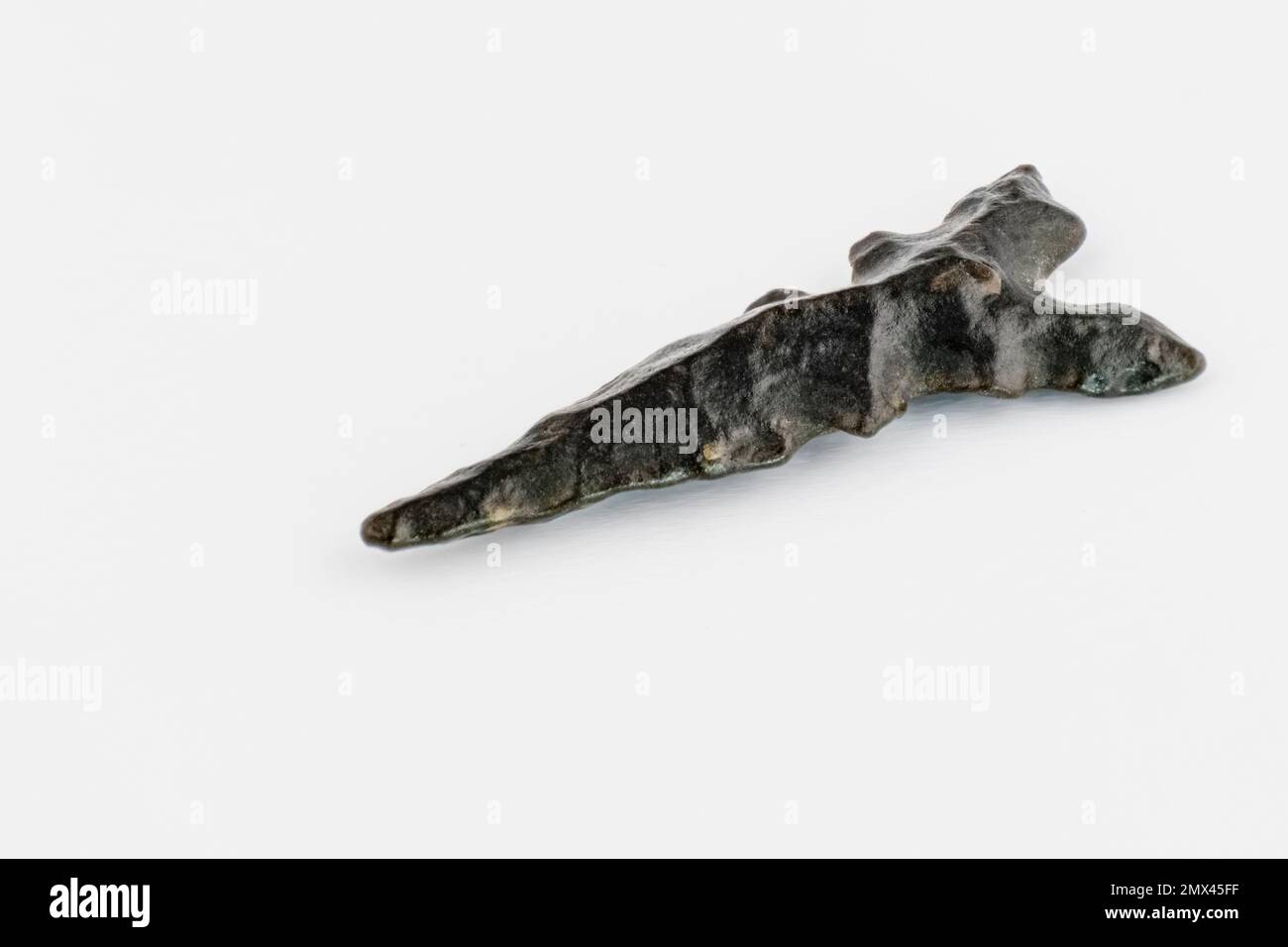 Macro image of an original arrowhead from the Paleolithic Age. High ...