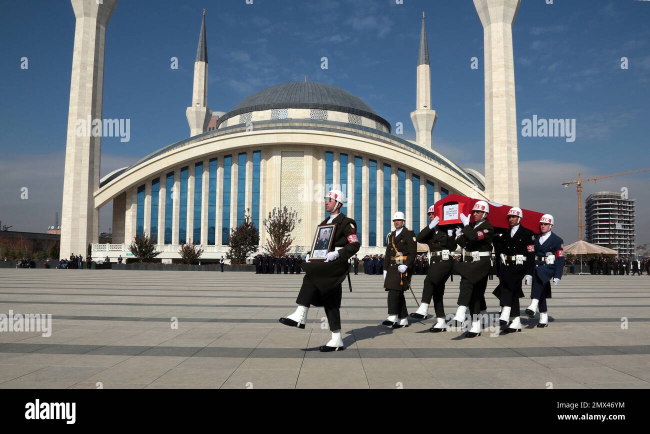 Honour guards carry the coffin of Alper Kocaman, a Turkish army officer ...