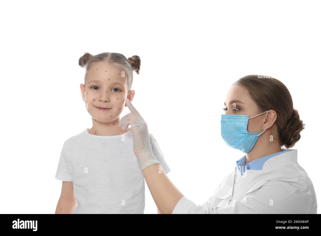 Doctor examining little girl with chickenpox on white background ...