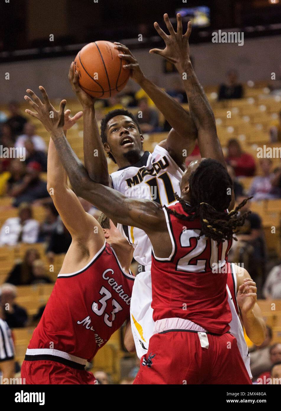 Missouri's K.J. Walton, center, shoots between Central Missouri's ...