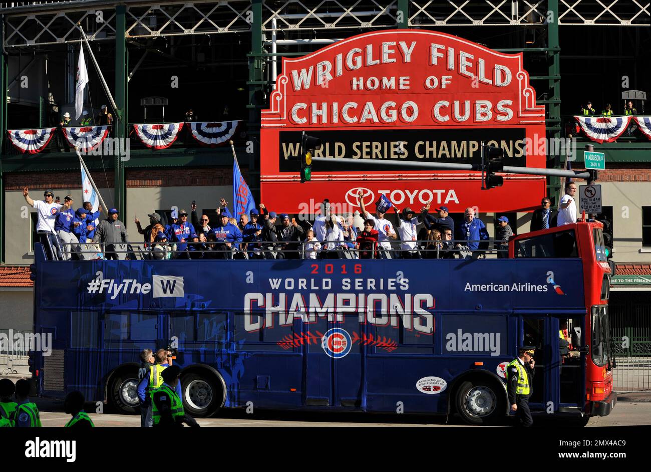 A bus carrying players, family and friends passes Wrigley Field during ...