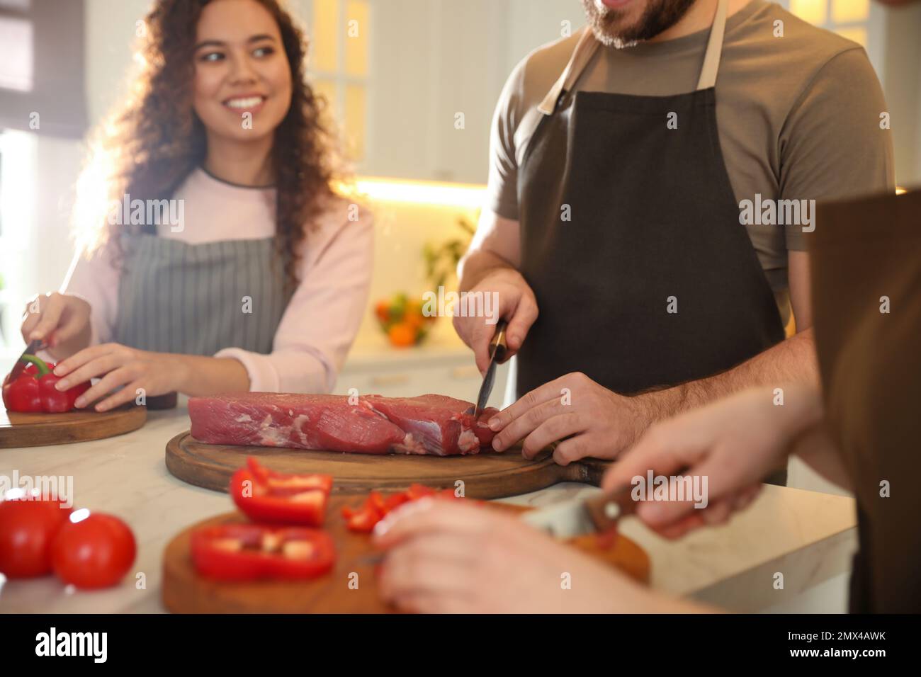 Diverse male friends cooking kitchen hi-res stock photography and ...