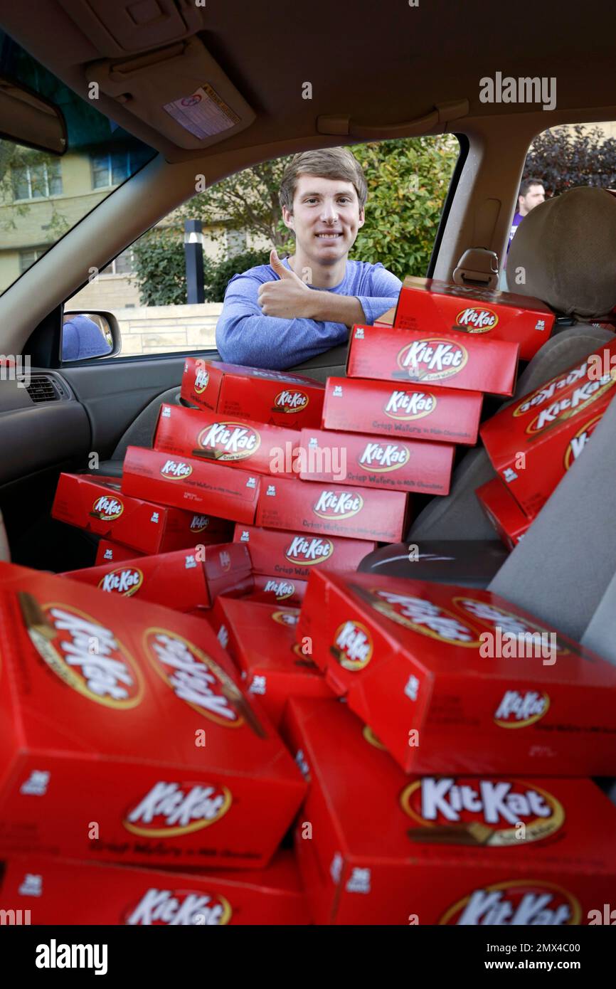 Hunter Jobbins, freshman at Kansas State University poses with his car ...