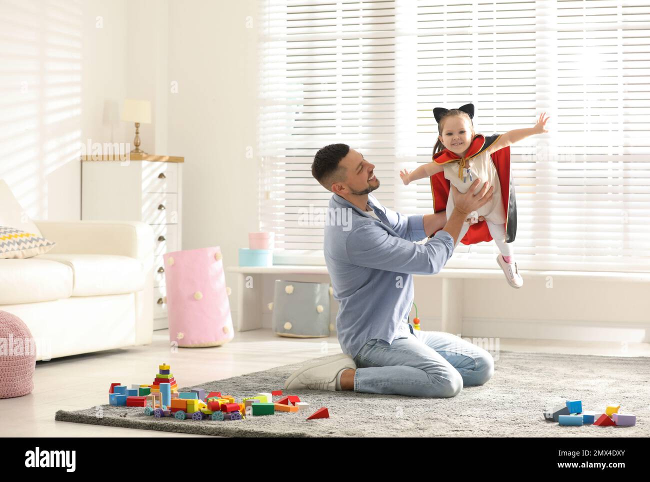 Father playing with his child at home Stock Photo - Alamy