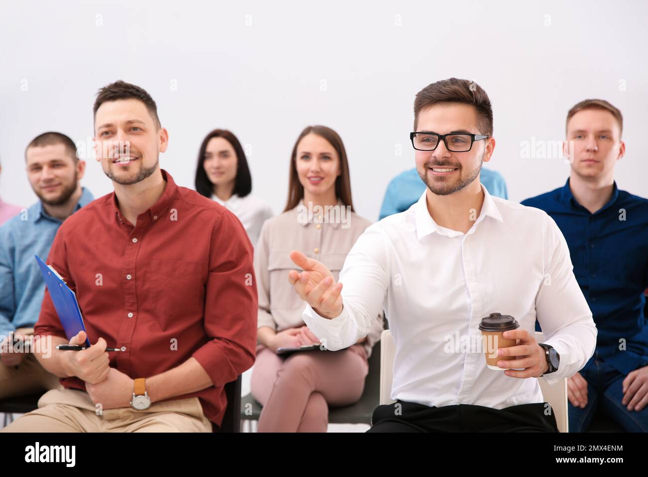Woman asking colleague question hi-res stock photography and images - Alamy