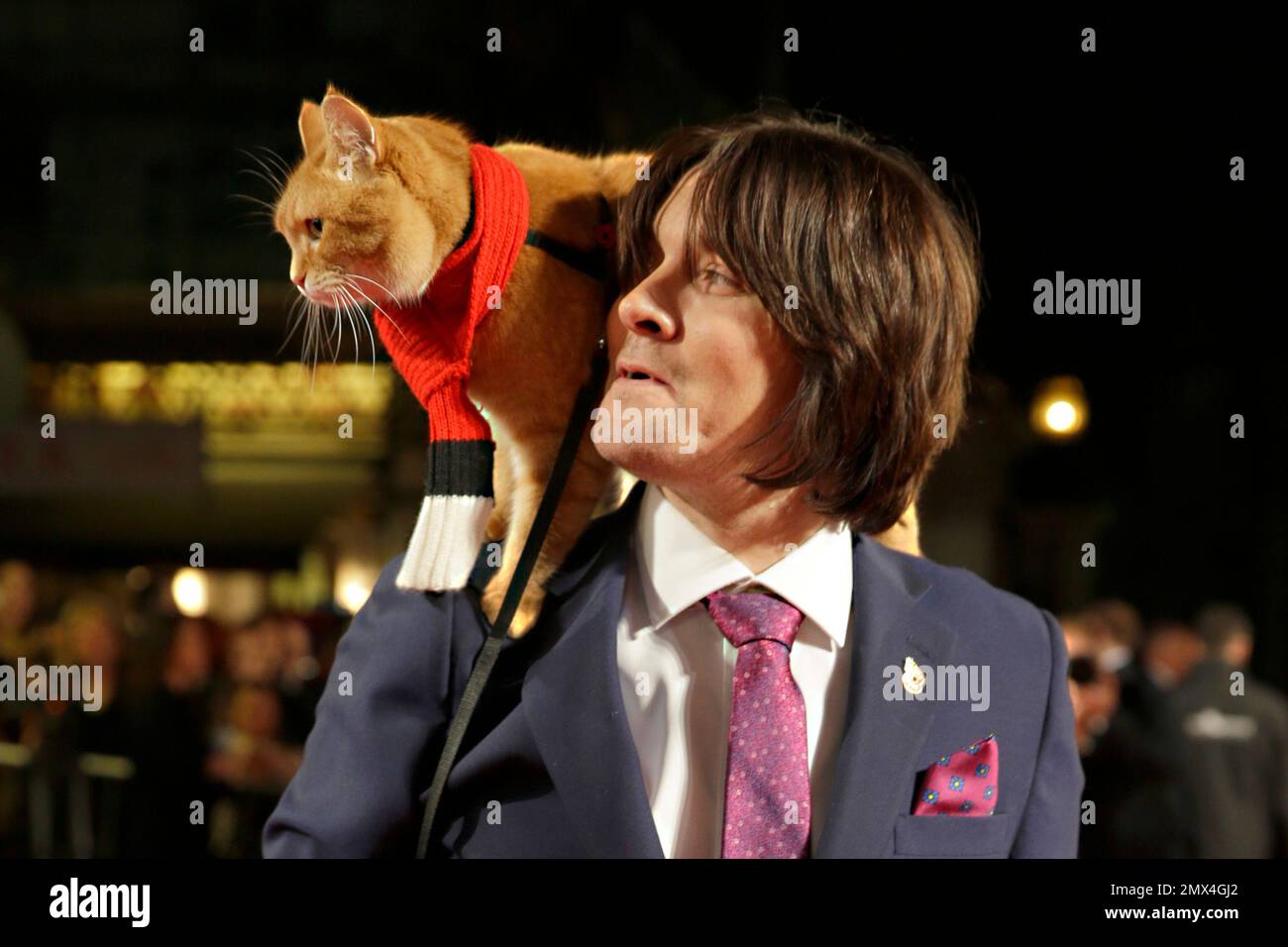 Writer James Bowen and Bob the cat pose for photographers upon arrival ...