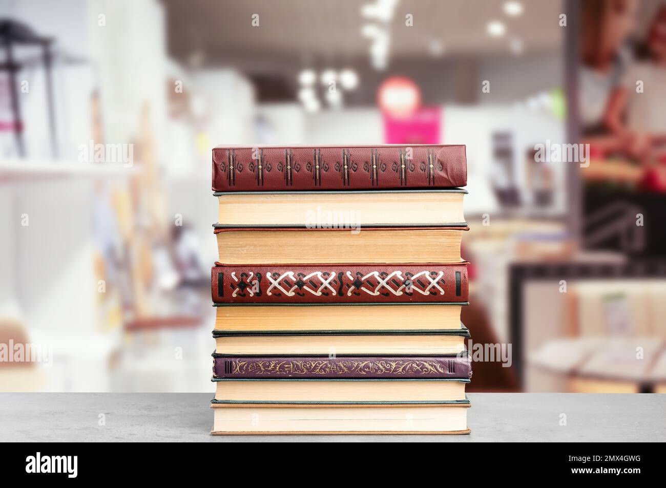 Collection of different books on table against blurred background Stock ...