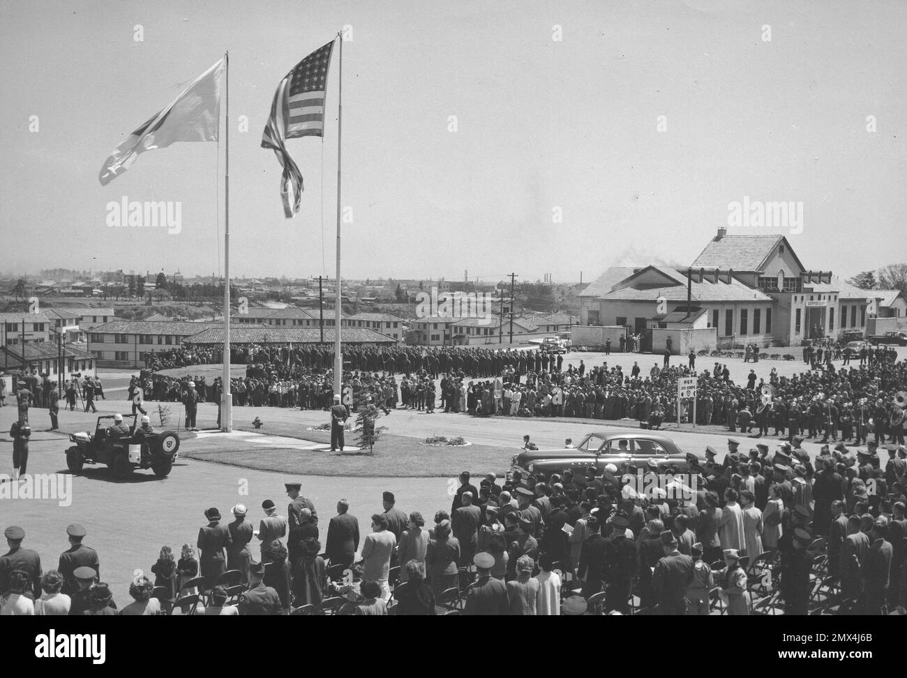 In this photo provided by the U.S. Army, Japanese and American flags ...