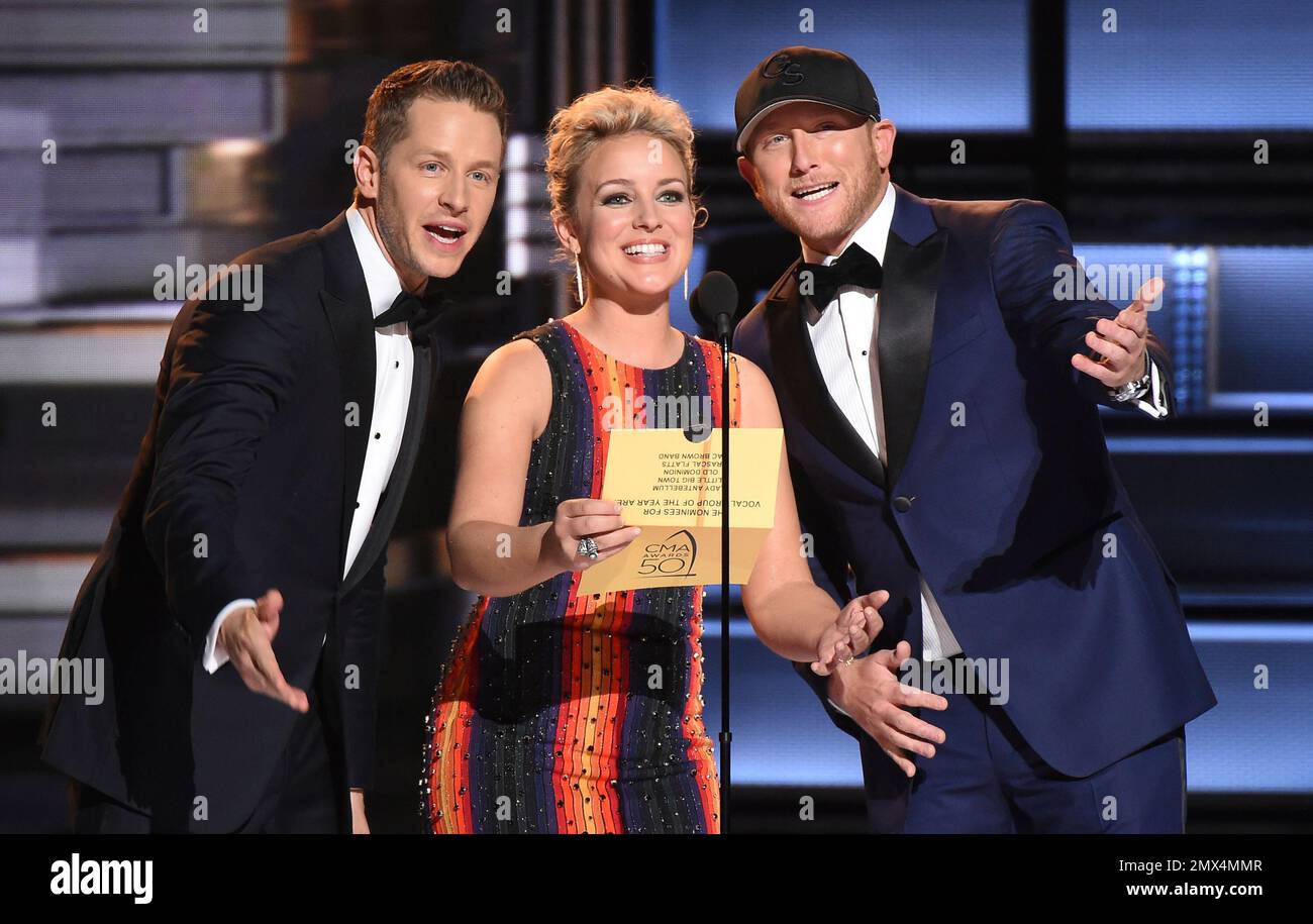 Josh Dallas, from left, Cam and Cole Swindell present the award for ...