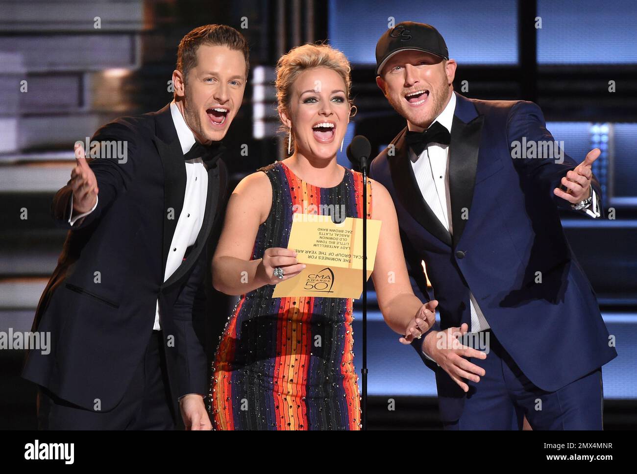 Josh Dallas, from left, Cam and Cole Swindell present the award for ...