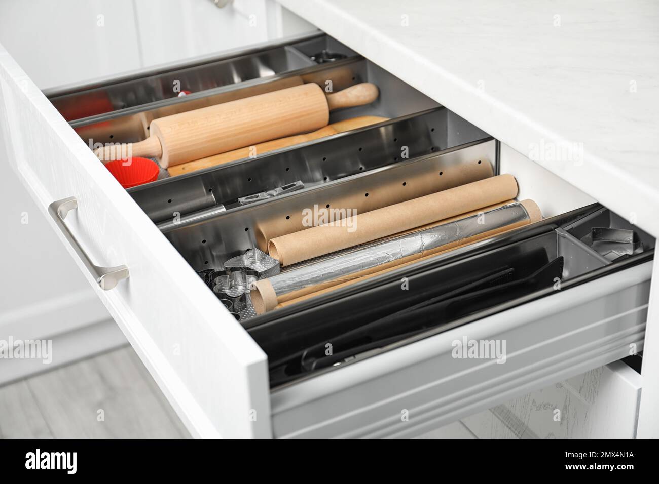 Different utensils in open desk drawer indoors Stock Photo - Alamy