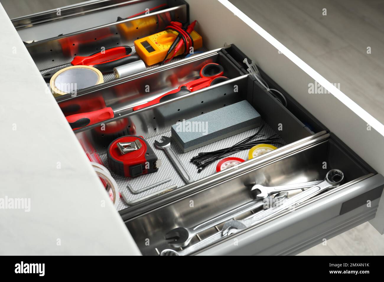 Set of instruments in open desk drawer indoors Stock Photo - Alamy