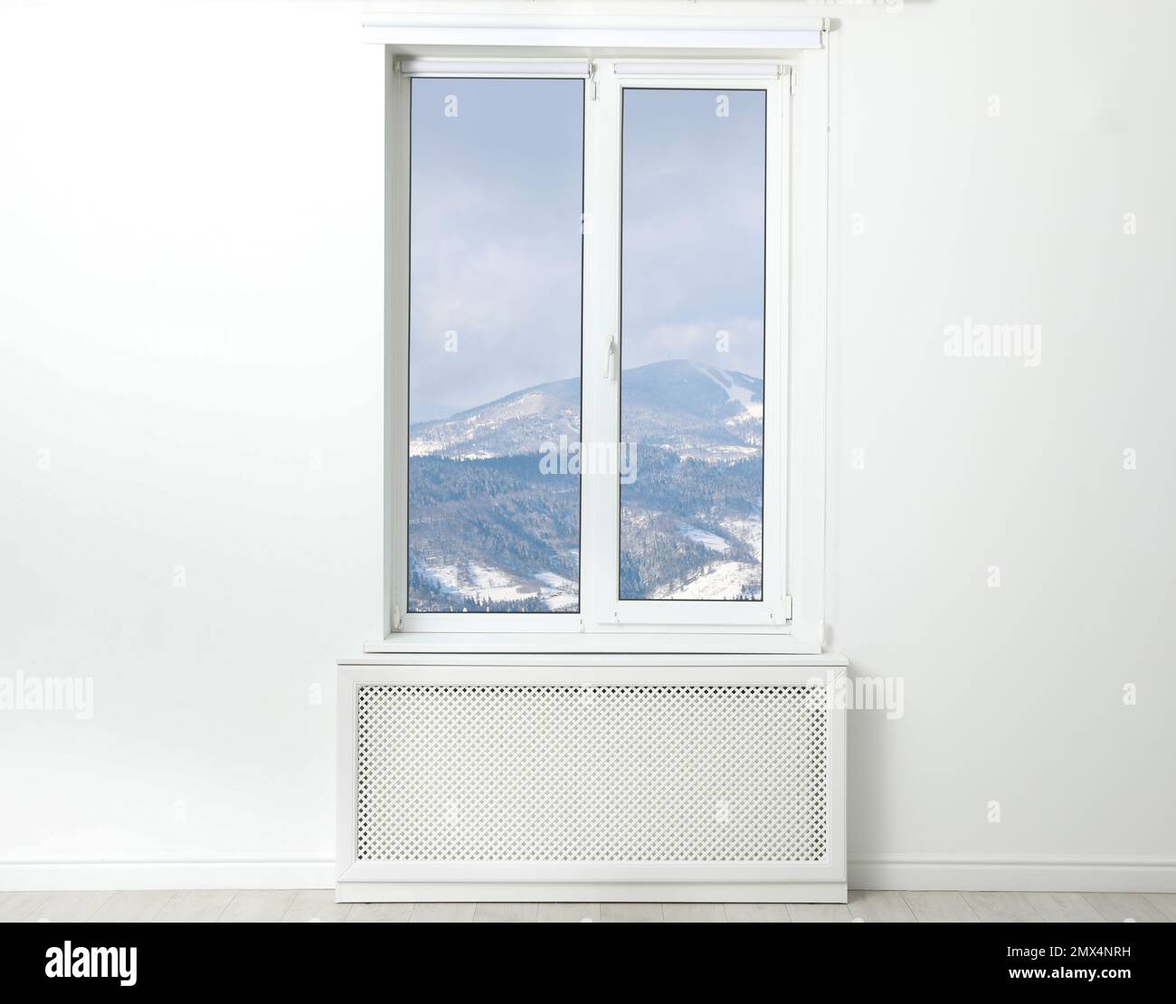 Beautiful view of snowy mountains through window Stock Photo - Alamy