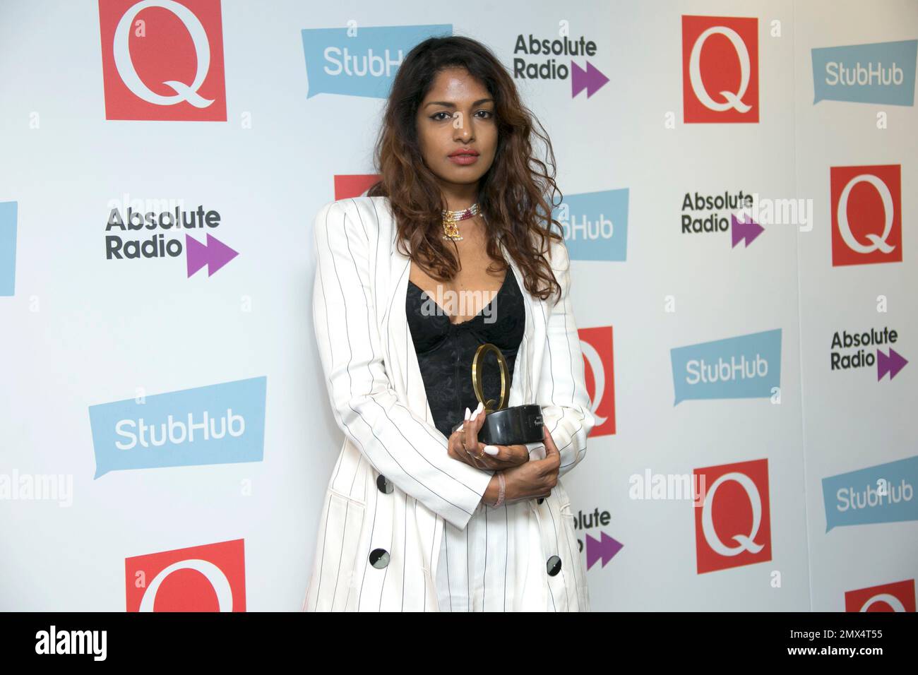 Singer M.I.A poses for photographers with her Innovation In Sound award ...