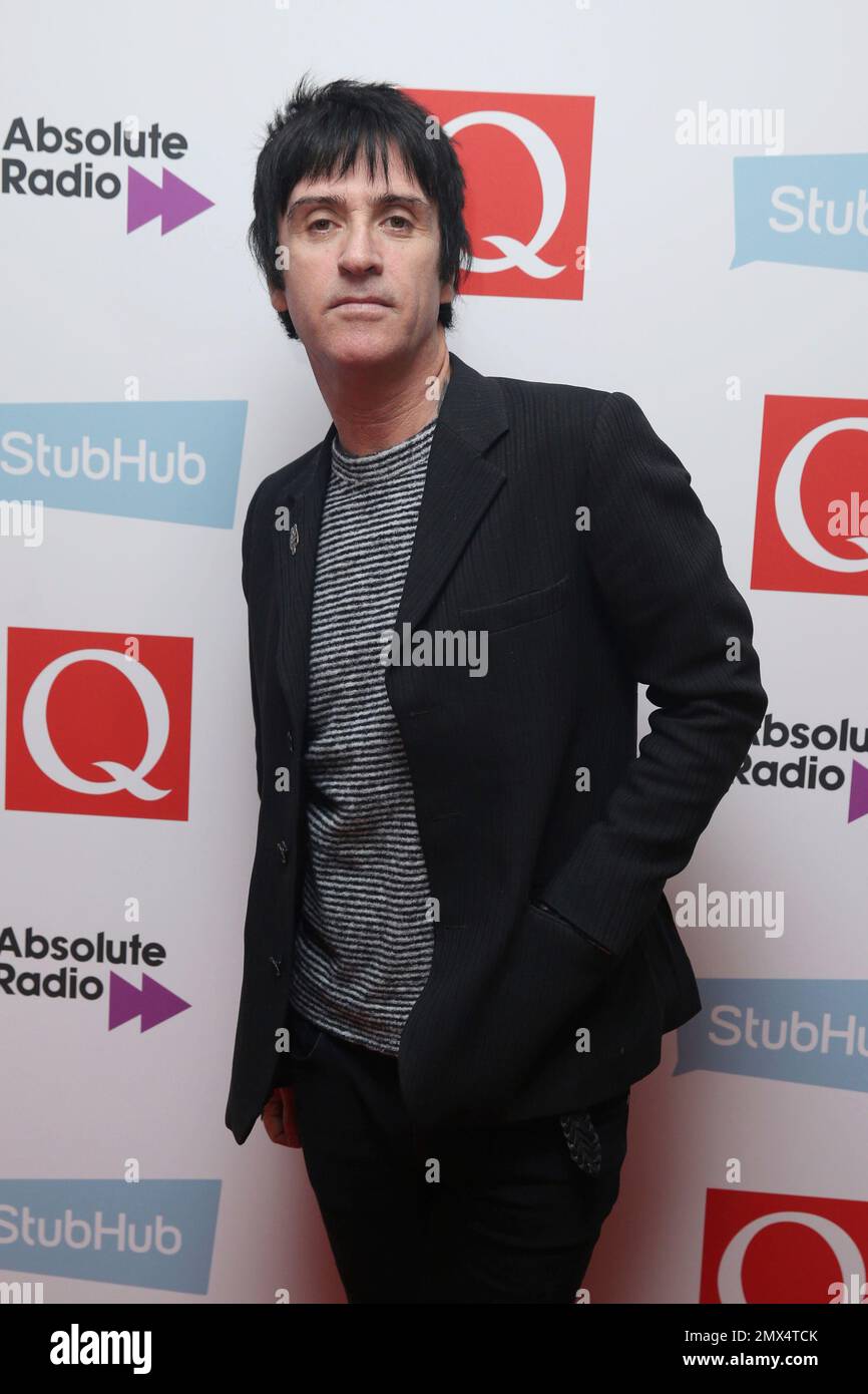 Johnny Marr poses for photographers upon arrival for the Q Music Awards ...