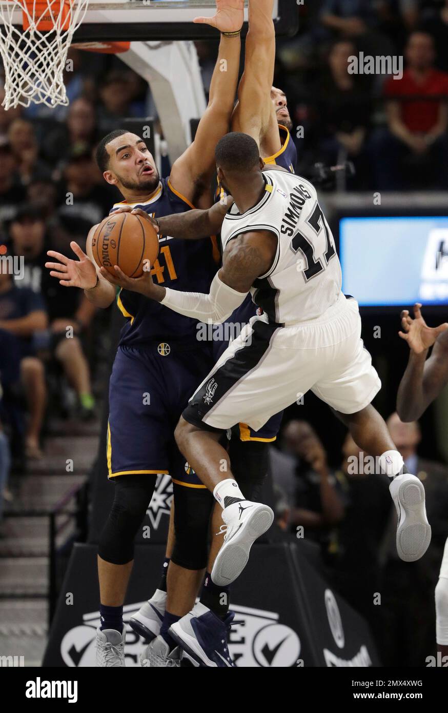 San Antonio Spurs forward Jonathon Simmons (17) is defended by Utah ...