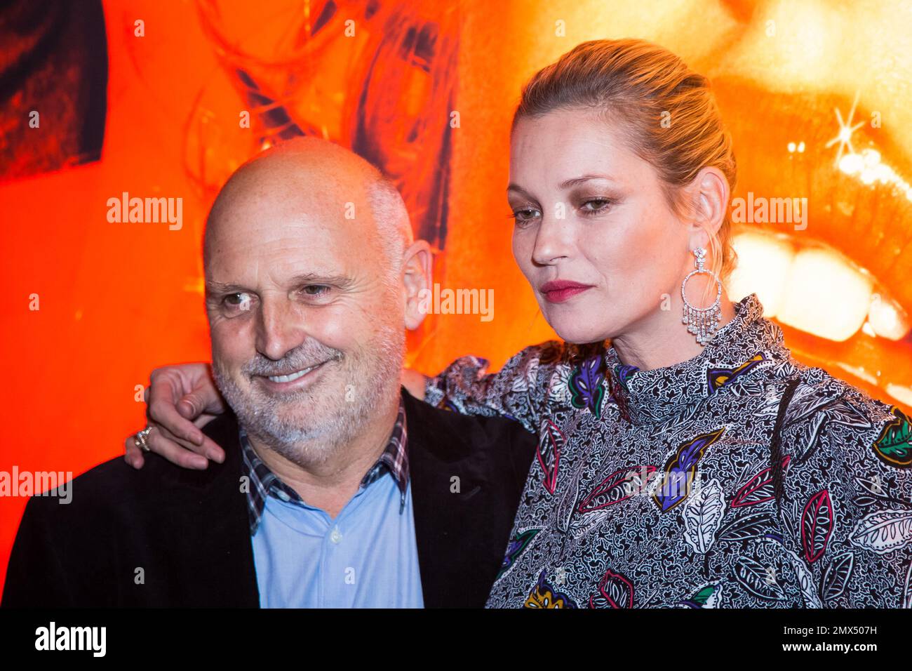 Hair stylist Sam McKnight and model Kate Moss pose for photographers ...