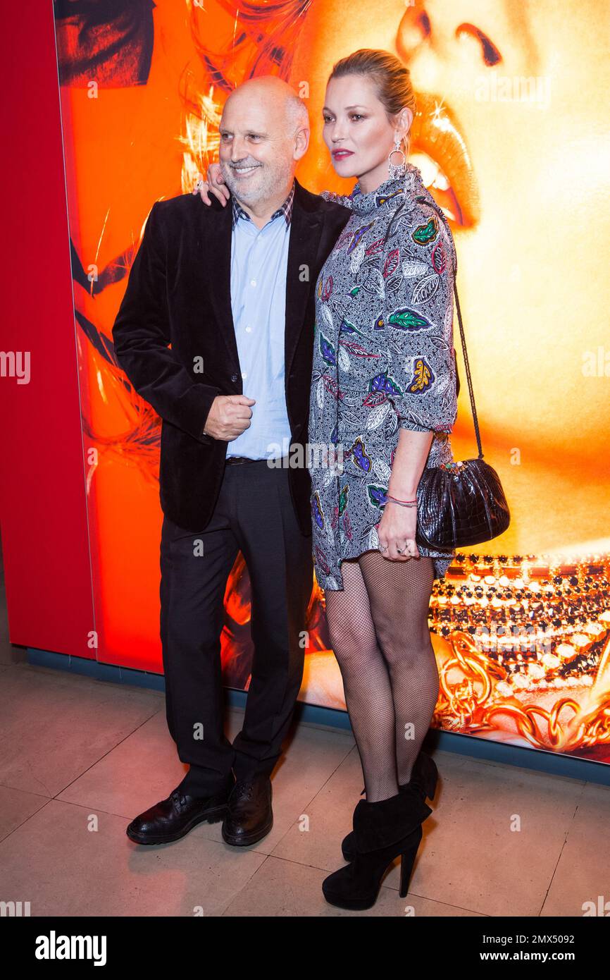 Hair stylist Sam McKnight and model Kate Moss pose for photographers ...