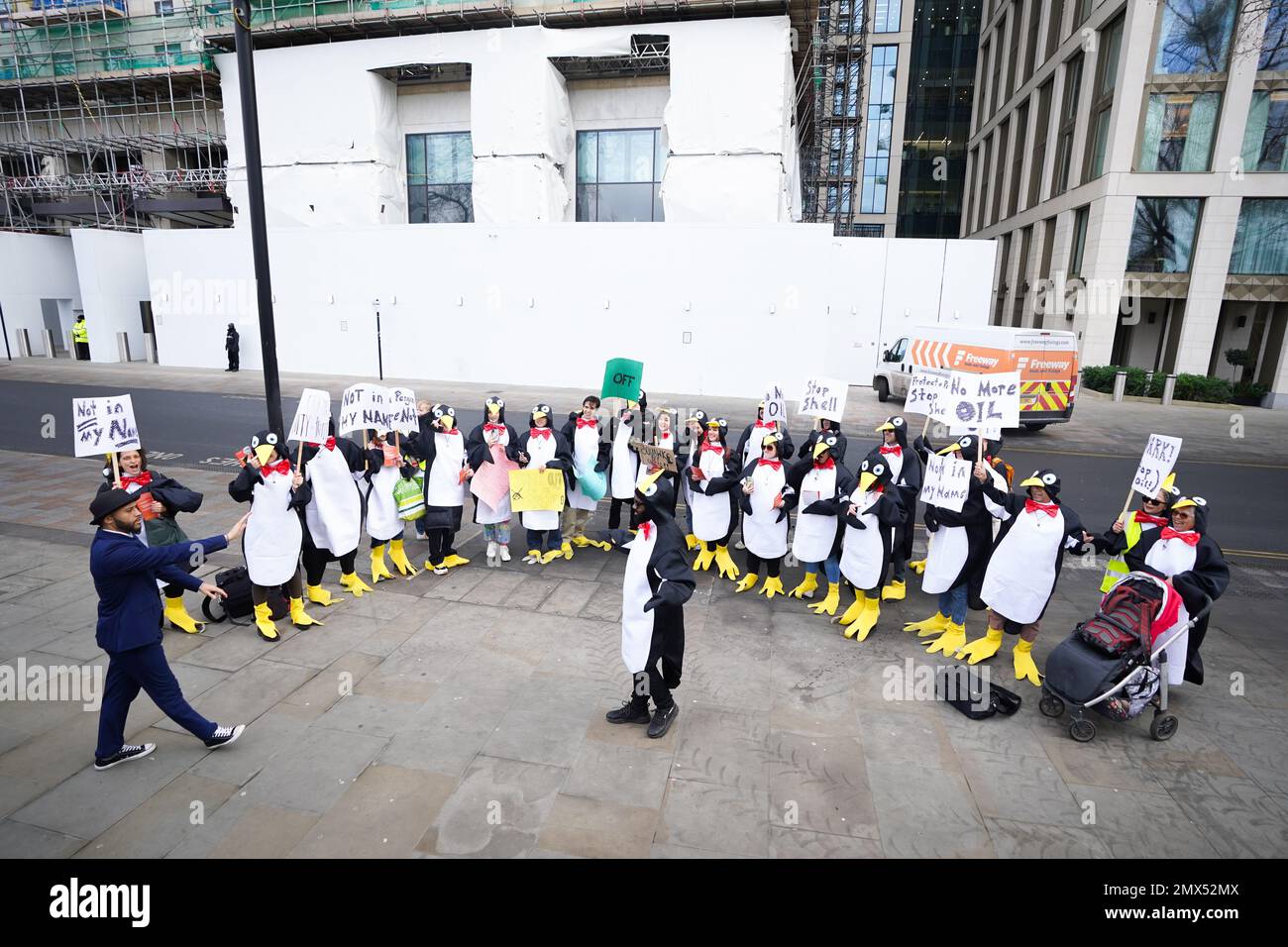 Demonstrators dressed as penguins outside Shell's HQ in Lambeth, south ...