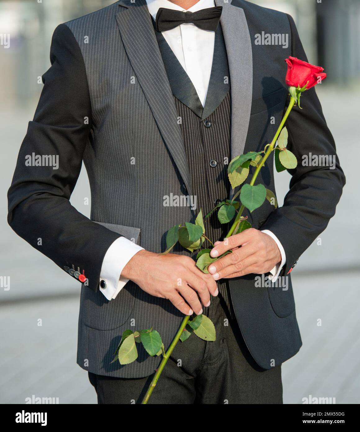 proposal concept. cropped view of black tux man making a proposal. man ...