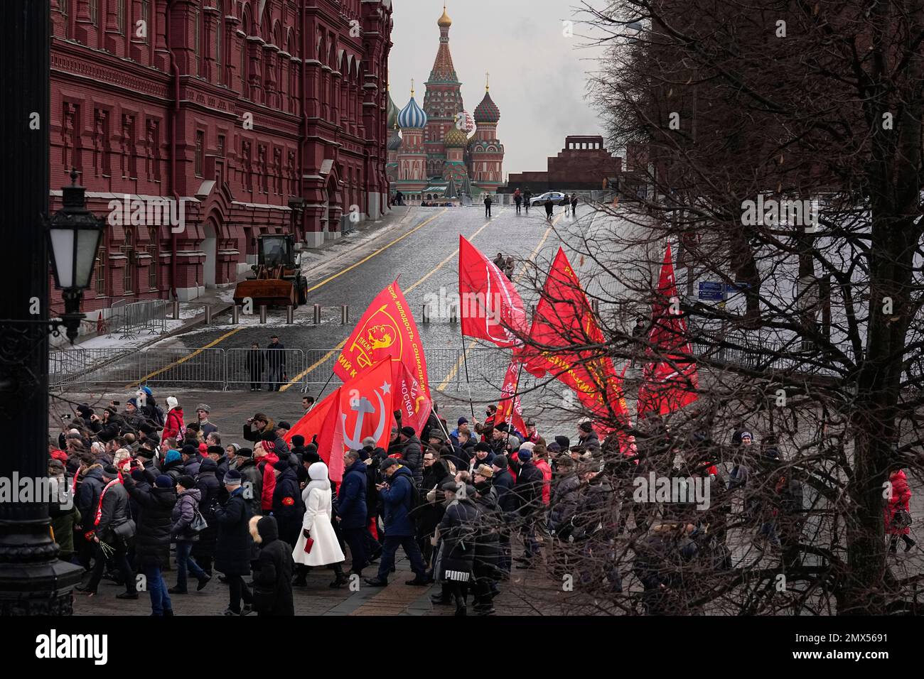 Communist's' party supporters with Red flags walk after a wreath-laying ...