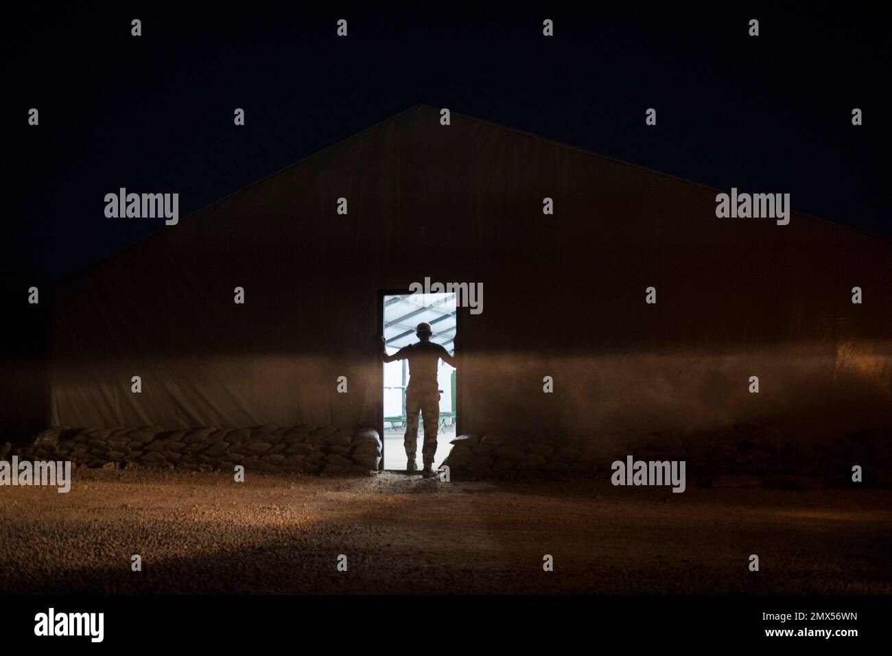 An Iraqi army soldier stands at the entrance of a tent at the Qayara ...