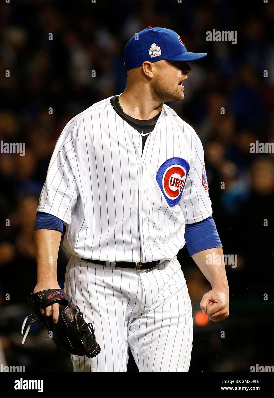 Chicago Cubs starting pitcher Jon Lester reacts during the fifth inning ...
