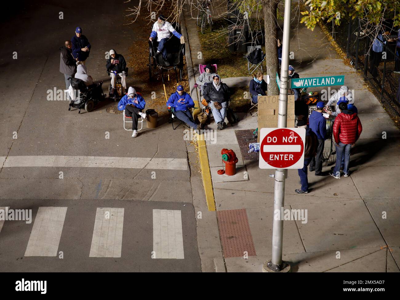Fans sit outside Wrigley Field before Game 5 of the Major League ...