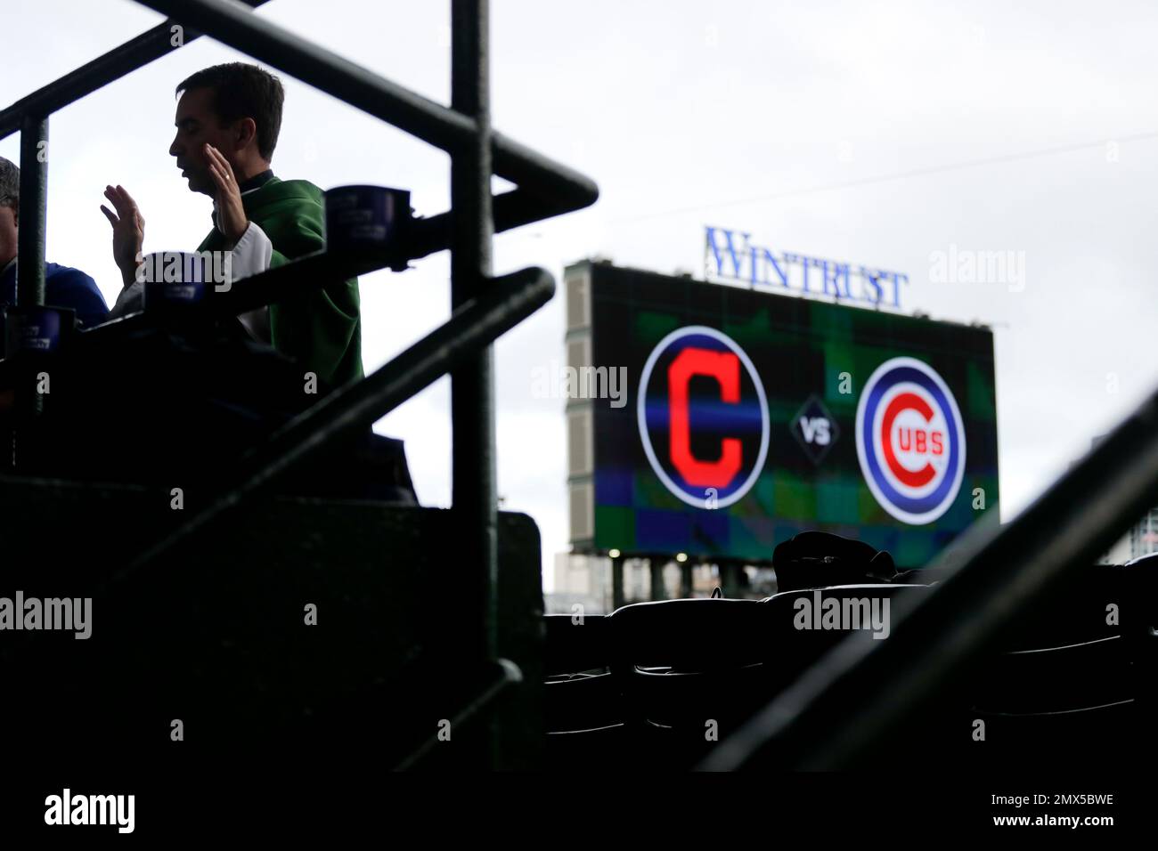 Rev. Burke Masters conducts a outdoor Mass in the Wrigley Field stands ...